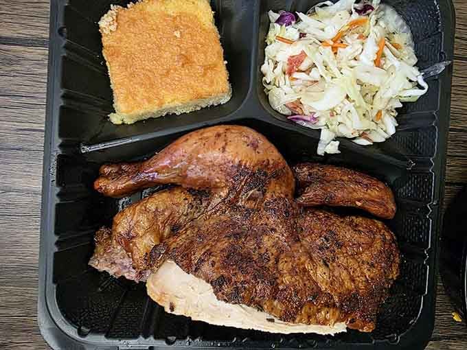 Smoked chicken with coleslaw and cornbread offers a lighter option, though "lighter" is definitely a relative term here.