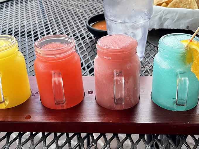 These mason jar drinks in carnival colors look like liquid sunshine, each one more Instagram-worthy than the last refreshing sip.