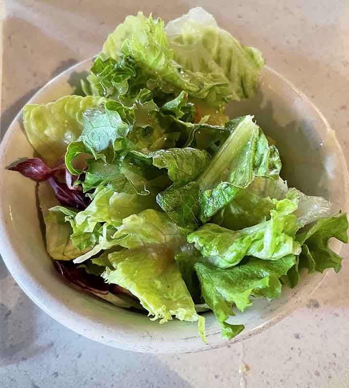 Fresh salad greens that prove even steakhouses understand the importance of balance, though let's be honest about what you're really here for.