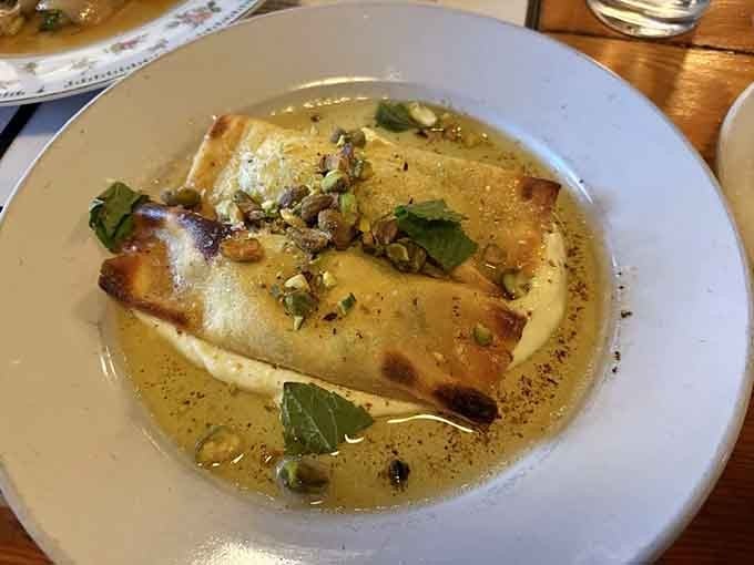 That spinach krokiety floating in golden sauce is Polish soul food elevated to poetry, comfort meeting elegance on one beautiful plate.