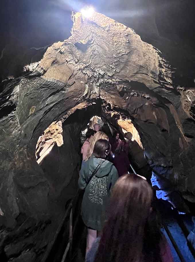 Dramatic rock formations tower overhead as visitors venture deeper into this otherworldly limestone labyrinth below Hellertown.