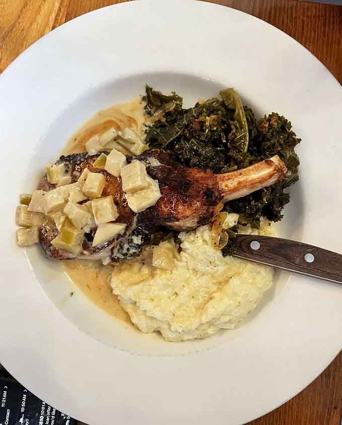 A bone-in pork chop this beautifully plated deserves its own standing ovation before you dig in.