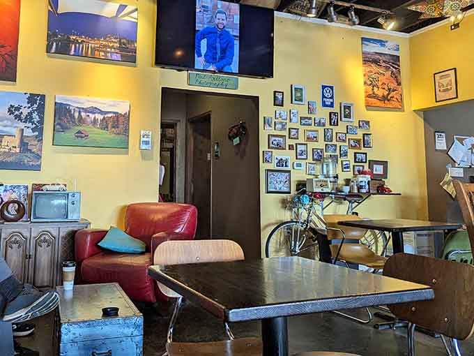 Yellow walls, vintage photos, and a bicycle hanging overhead create the kind of quirky charm money can't buy.
