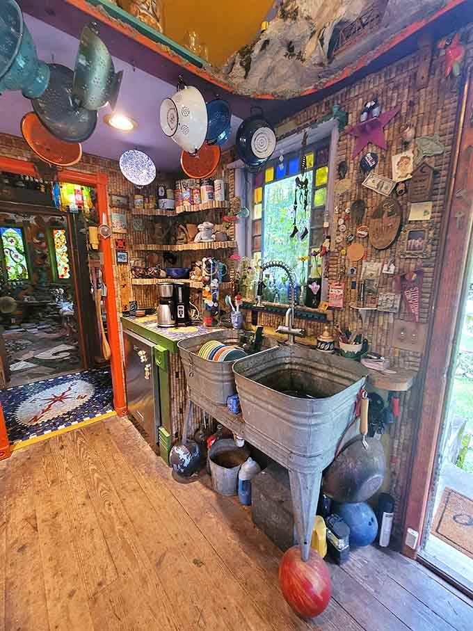 That vintage sink surrounded by found objects transforms a simple washbasin into pure folk art poetry.