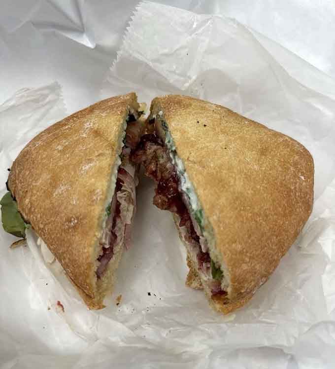 That sandwich cross-section reveals layers of deliciousness that would make any architect jealous of this structural masterpiece right here.