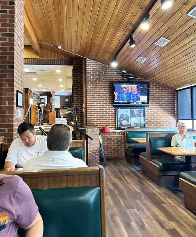 The dining room buzzes with happy customers contemplating their life choices and ordering another round anyway.