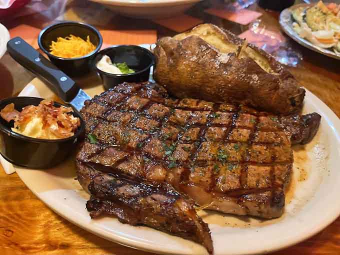 A ribeye steak so generously sized it comes with its own zip code and side dish entourage.
