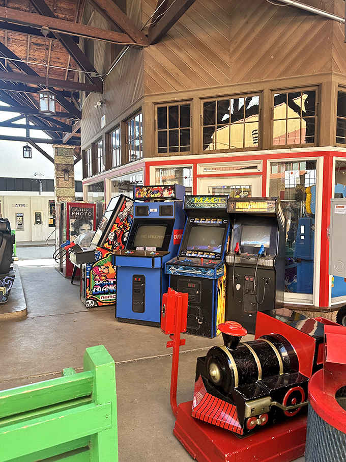 Classic arcade cabinets standing at attention like soldiers from the golden age of gaming, still battle-ready.