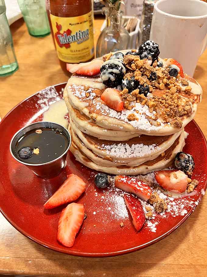 These buttermilk pancakes stack up tall and proud, topped with fresh berries that add both color and a burst of natural sweetness.