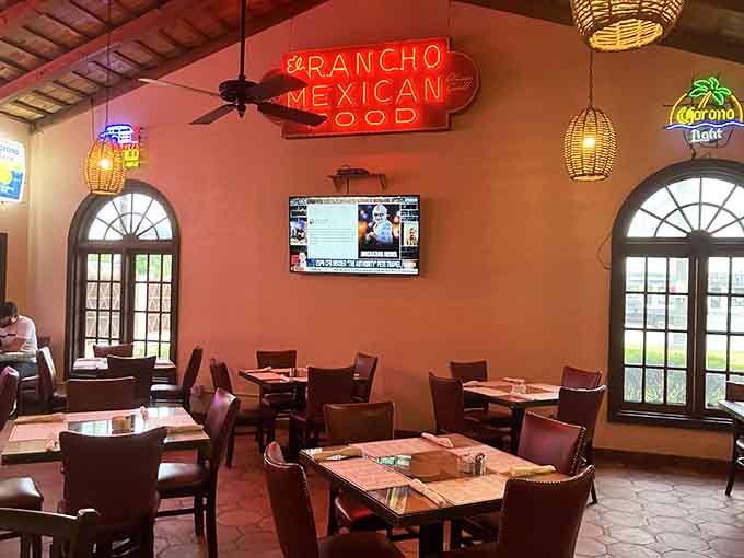 Vintage neon glowing against warm walls, where decades of happy diners have settled in for memorable meals together.