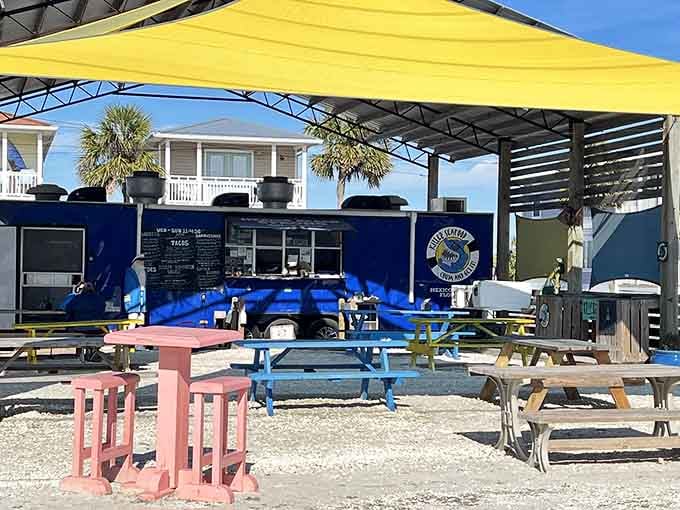 Bright blue picnic tables under sunny yellow umbrellas create the perfect spot for seriously fresh Gulf seafood.