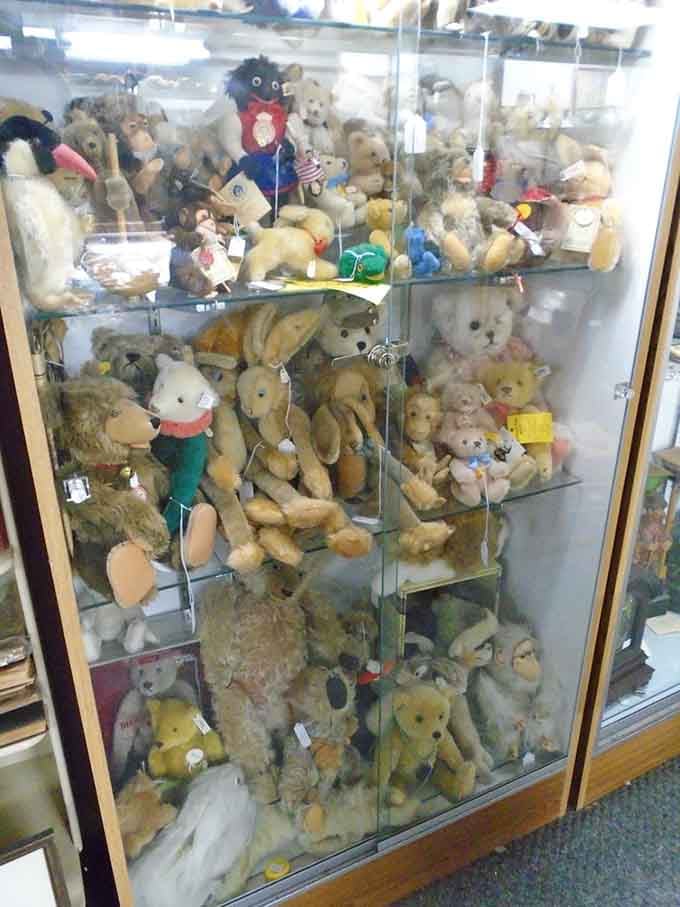 A glass case packed with stuffed animals from decades past, their button eyes witnessing countless shopping expeditions.