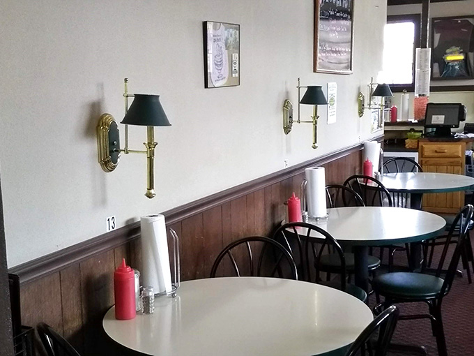 Wall sconces and comfortable seating create an atmosphere where rushing through your meal feels like missing the whole point entirely.