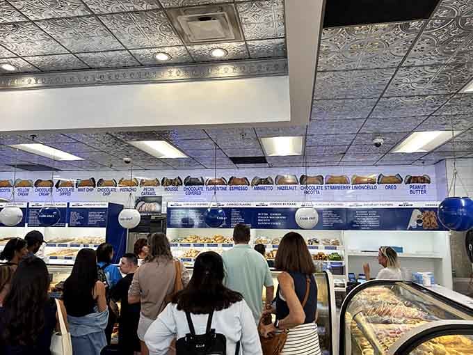 The crowd inside moves with purpose, everyone united in their quest for the perfect pastry to call their own.