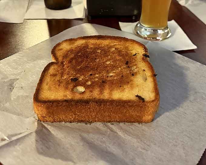 Even the grilled cheese gets the royal treatment, toasted to golden perfection for those rare non-burger moments.