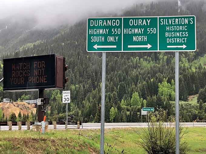 The highway signs point you toward adventure, though they diplomatically avoid mentioning the white-knuckle driving ahead.