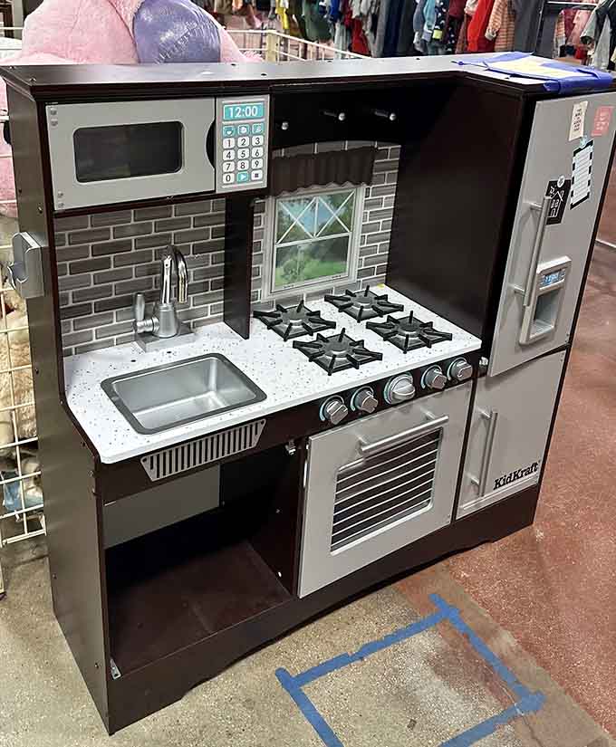 This play kitchen set costs less than actual groceries but provides infinitely more entertainment value.