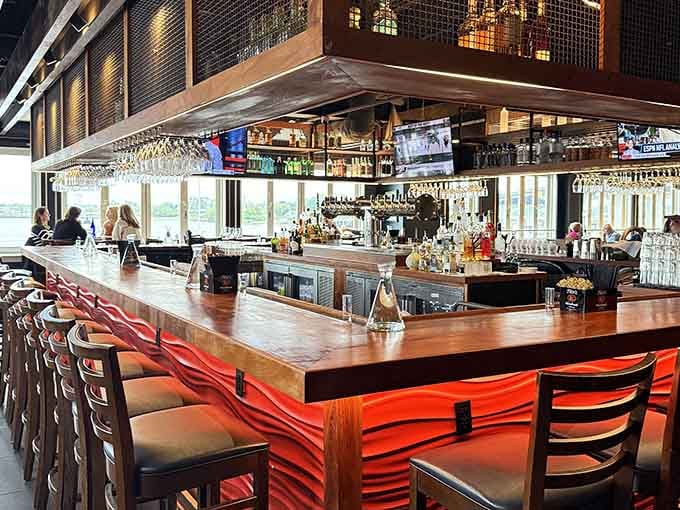 The bar stretches invitingly with harbor views, stocked and ready to keep those mimosas flowing all morning long.