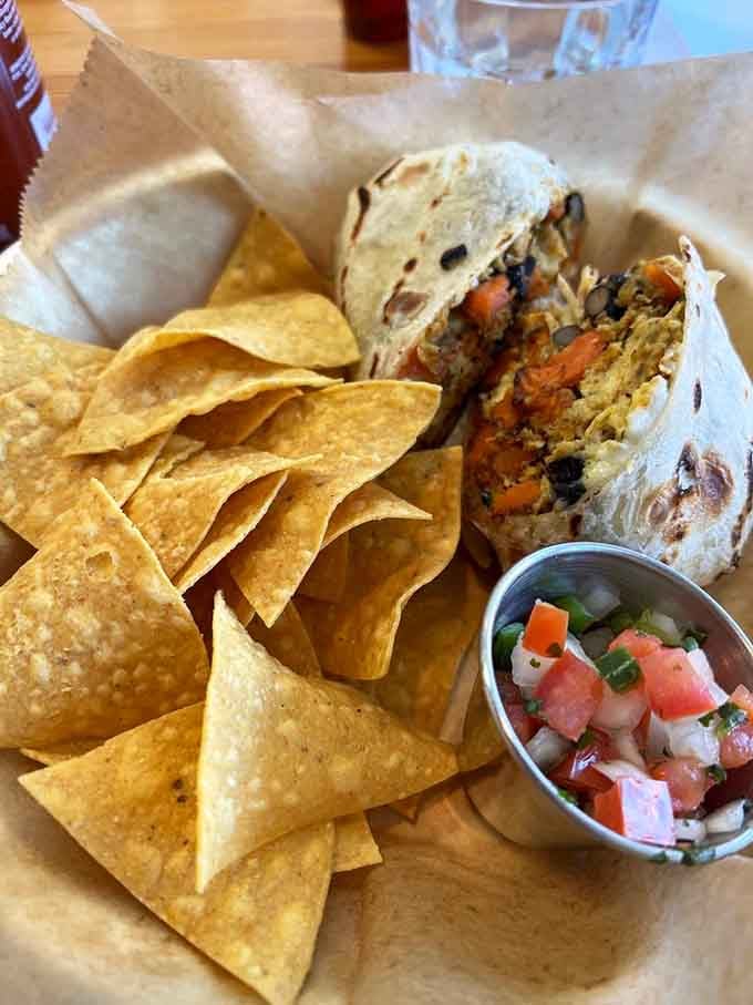 Southwest burrito packed so full of goodness it requires both hands and possibly a strategic eating plan to conquer.