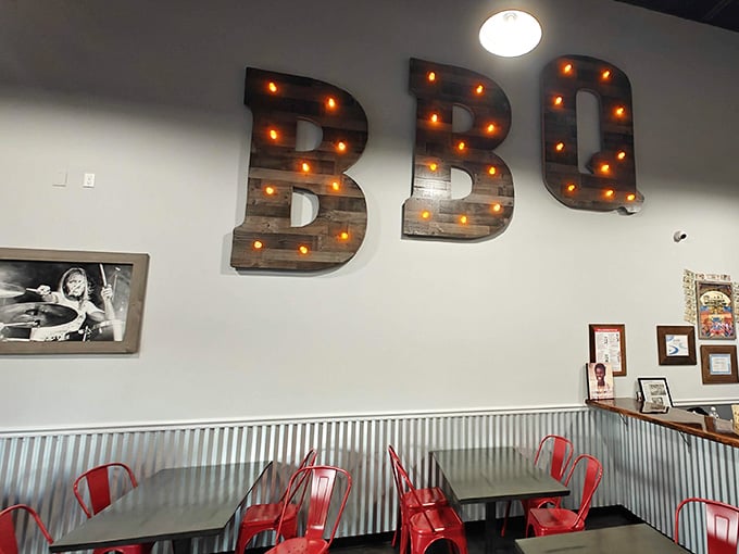 Giant BBQ letters lit up like a Broadway marquee, celebrating smoked meat in style.