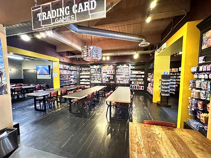 The trading card games section features dedicated tables where serious players plot their next moves over serious snacks.