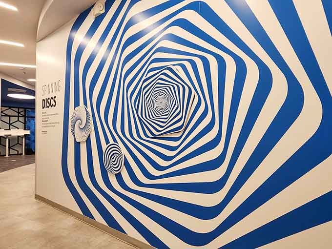 Stare too long at these spinning discs and you'll swear they're actually moving across the wall.