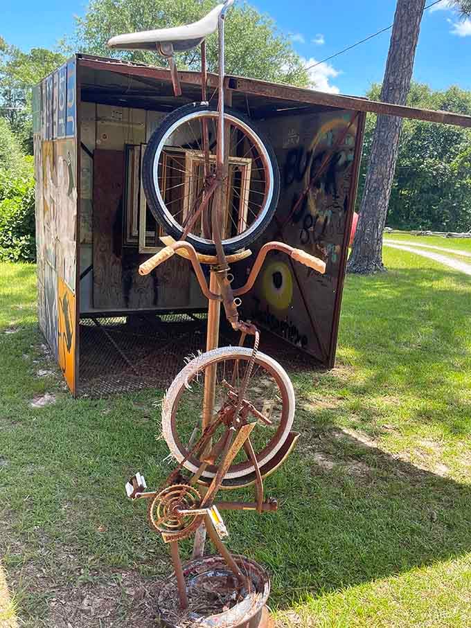 Vintage bicycle parts stack vertically into whimsical sculpture, proving one person's junk is another's masterpiece waiting to happen.