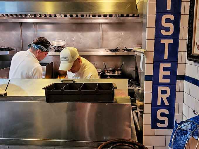 The kitchen crew working their magic in tight quarters, turning fresh catch into edible poetry all day long.