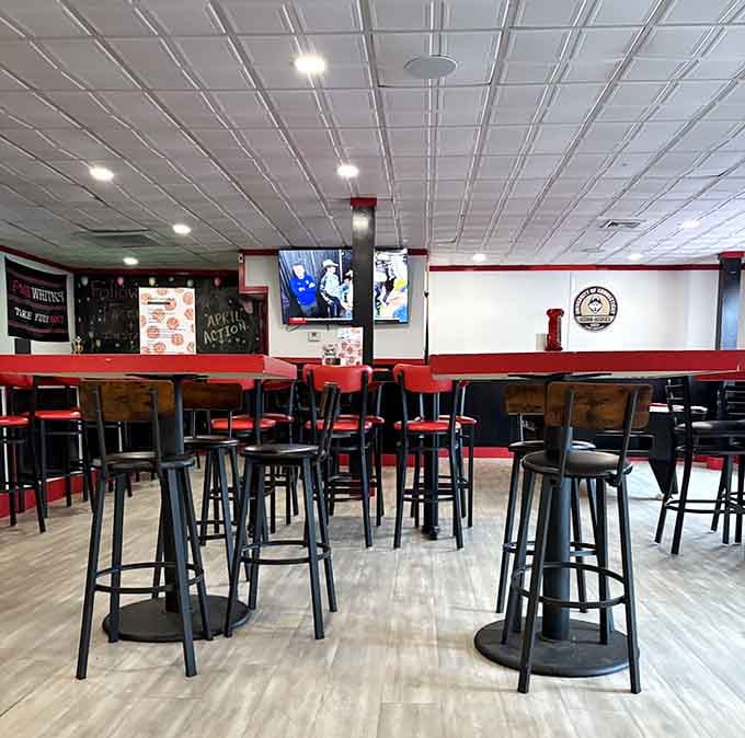 High-top seating with TVs overhead: the perfect setup for watching the game while demolishing a pie.