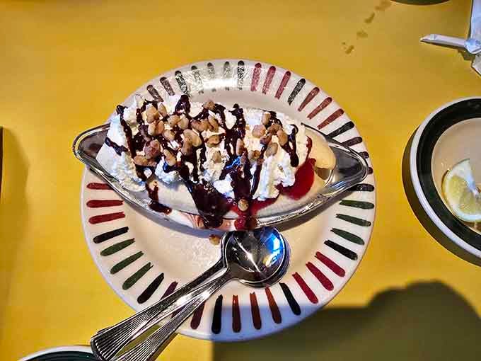 Ice cream sundaes topped with whipped cream and nuts make you remember why dessert exists in the first place.