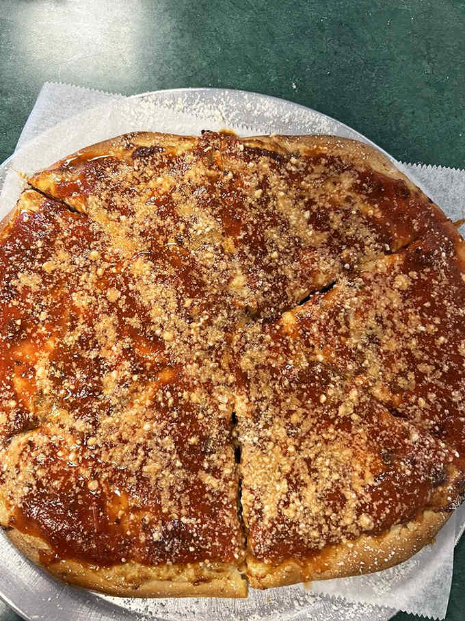 The way that cheese stretches and the crust holds firm tells you this pizza has structural integrity and serious flavor credentials.