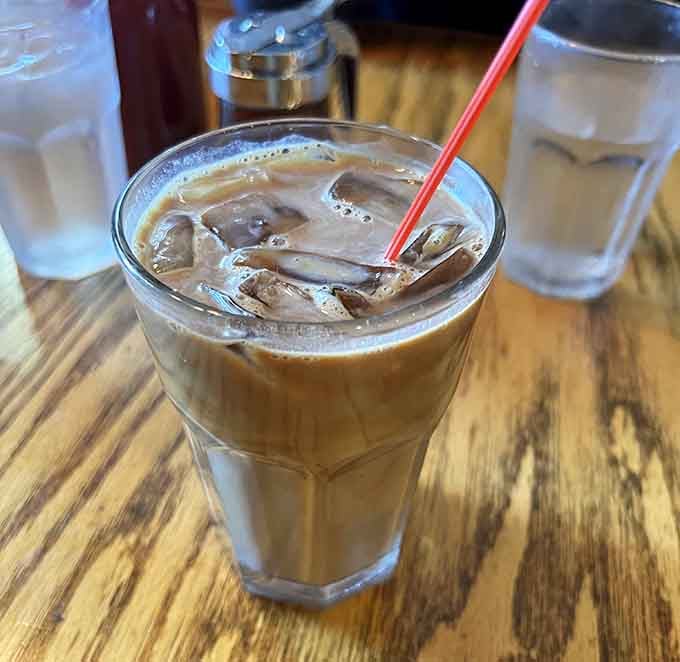 Iced coffee served in a proper glass because even your morning caffeine deserves to feel a little fancy.