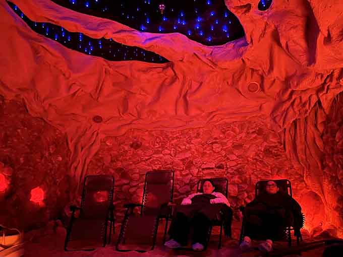 Pure bliss captured in a photograph as visitors sink into relaxation mode surrounded by glowing salt walls.