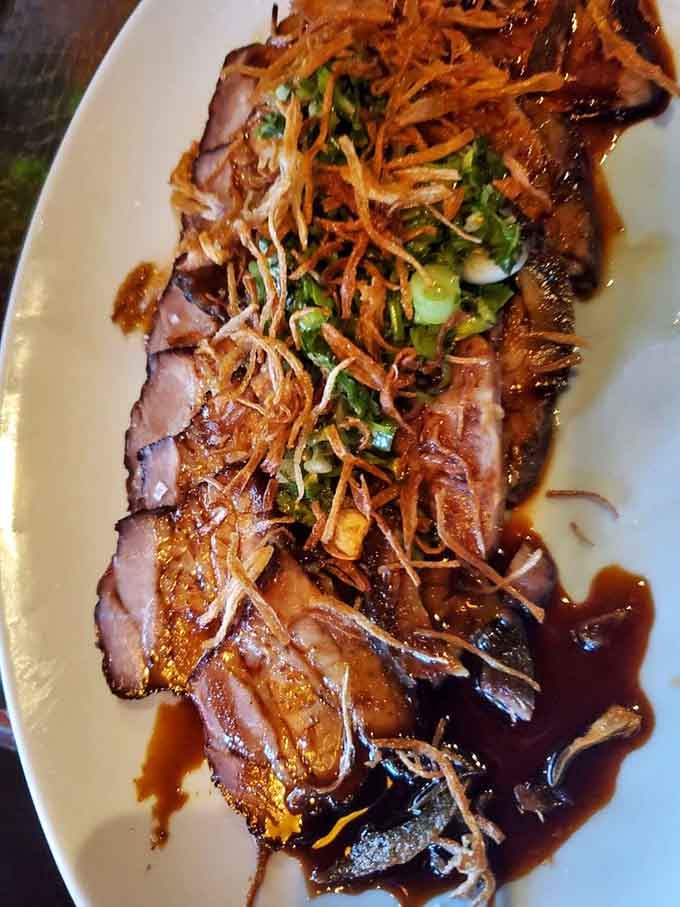 Char siu pork belly glistening under the lights like edible treasure that's absolutely worth the hunt to find it.