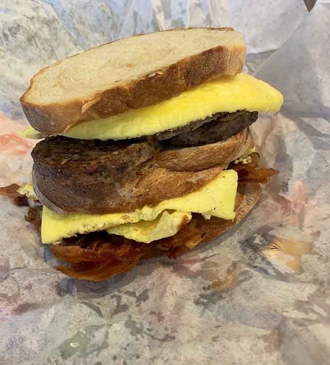 That towering breakfast sandwich on fresh bread proves that sometimes more really is more, especially before noon.