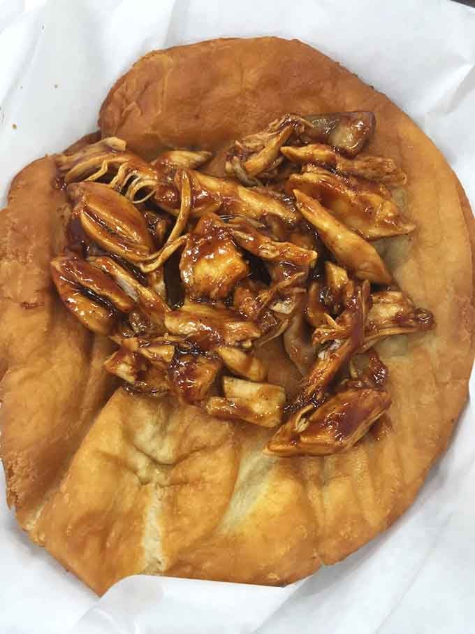 Golden fry bread drizzled with sweet toppings transforms simple dough into something that'll make your taste buds sing old campfire songs.