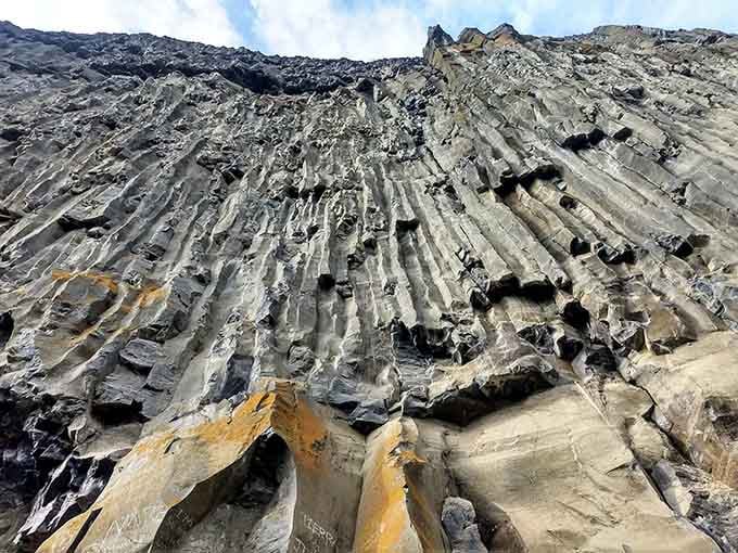 Those dramatic basalt columns reveal layers of ancient lava flows, because this place has serious geological street cred.