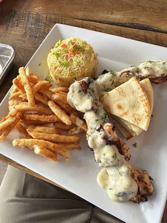 Chicken souvlaki with rice and all the fixings, because even dinosaurs would appreciate Mediterranean cuisine.