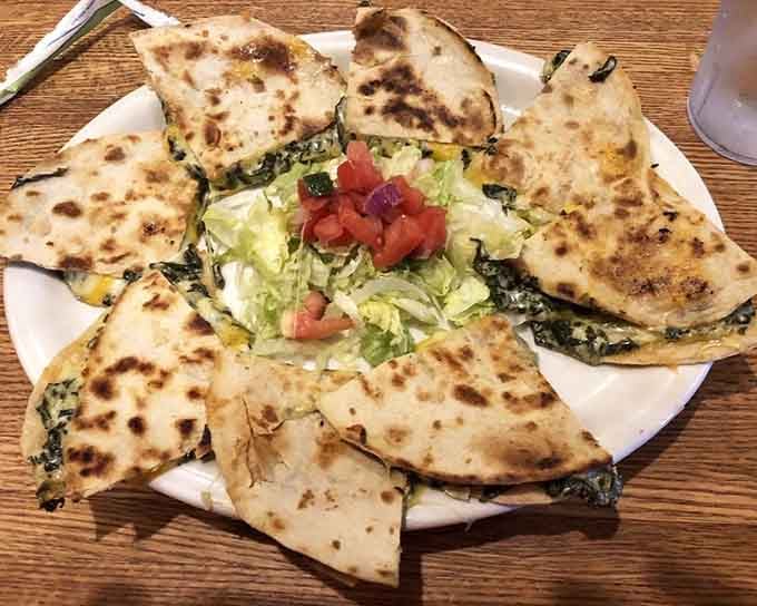 Spinach quesadillas cut into perfect triangles, ready to disappear faster than your willpower around melted cheese.