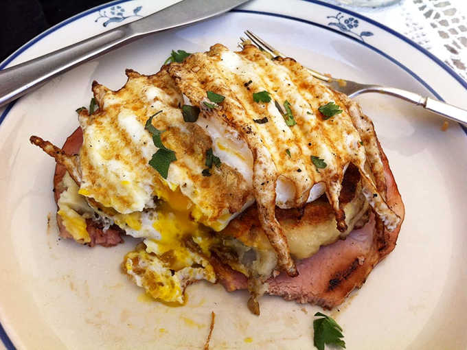 The Huntsman Breakfast stacks crispy hash browns with eggs and melted cheese like edible architecture.