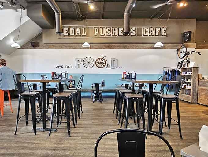 The "Love Your Food" wall art isn't just decoration, it's basically the cafe's mission statement written in bicycle wheels.
