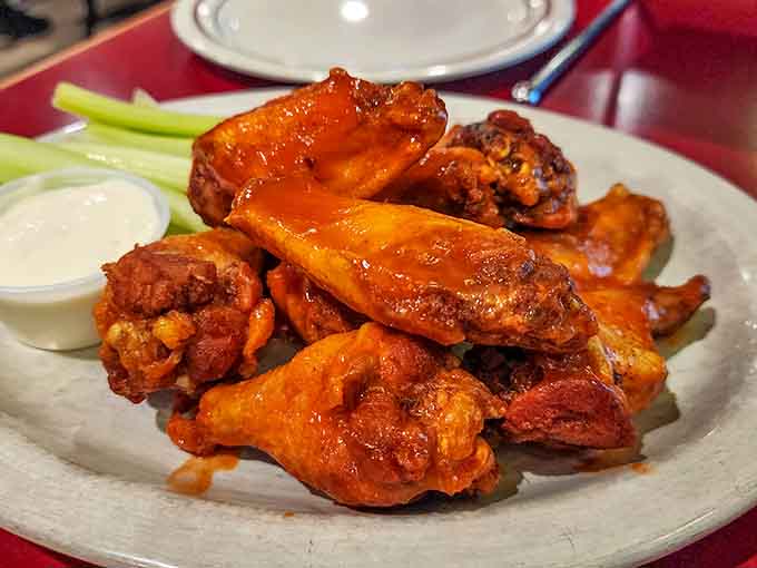 These buffalo wings arrive glistening and ready to make you forget you ever ordered pizza in the first place.