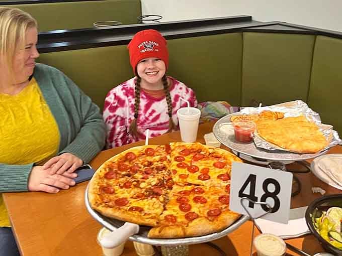 The smiles say it all when the pizza lives up to decades of hype and hometown pride.