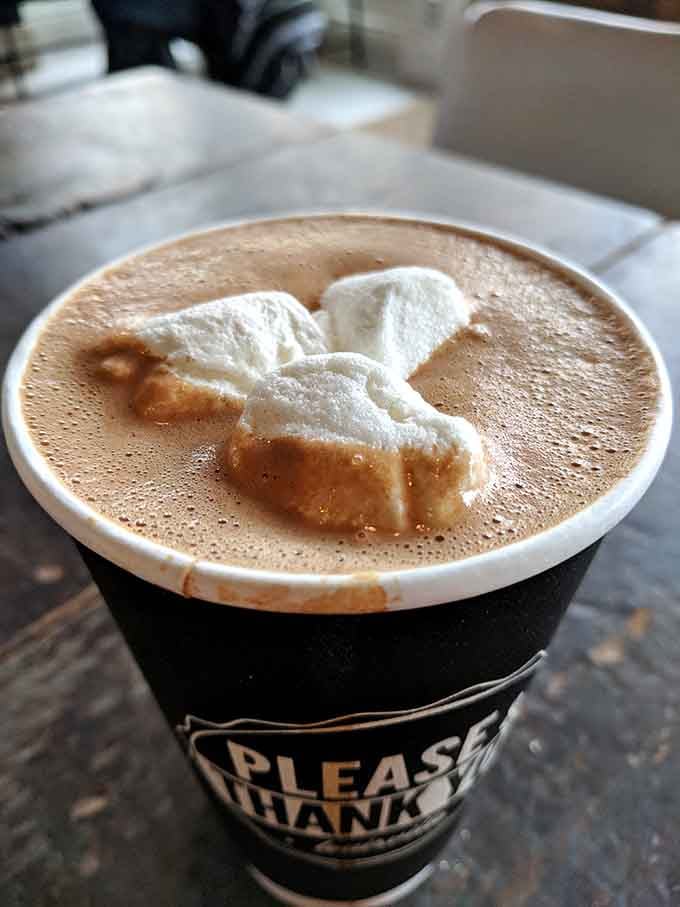 Hot chocolate topped with marshmallows shaped like a bunny, proving that whimsy and caffeine make excellent companions.
