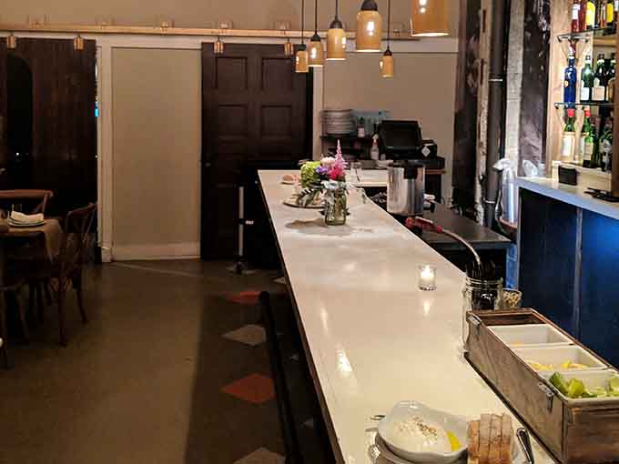 The sleek serving counter where pizza dreams become delicious reality, one wood-fired pie at a time.