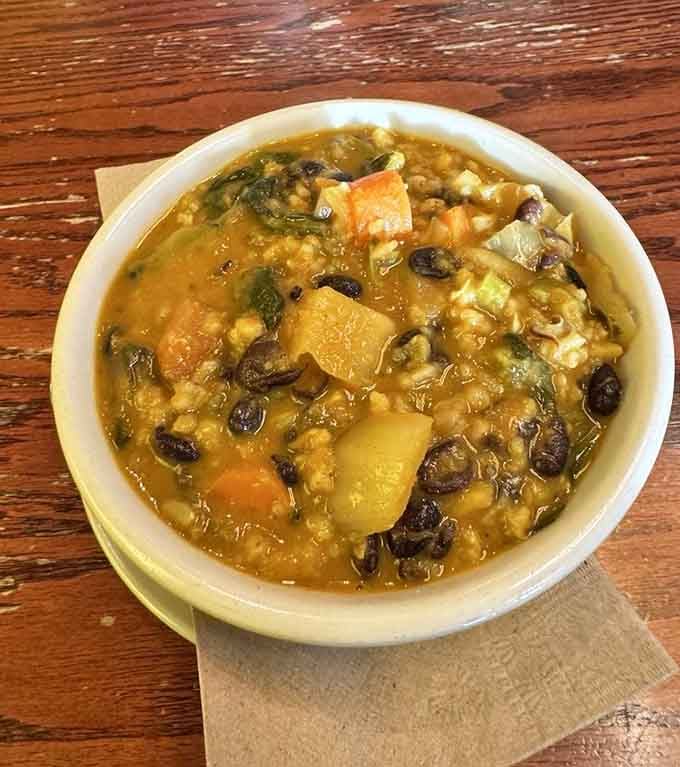 Green lentil curry packed with vegetables and flavor, warming you from the inside out on any Ohio morning.