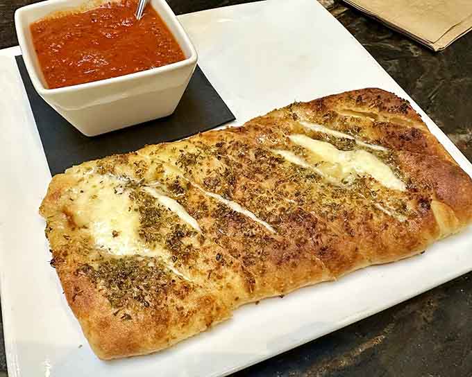 Stuffed cheese bread arrives golden and fragrant, basically garlic bread's overachieving cousin who went to culinary school.
