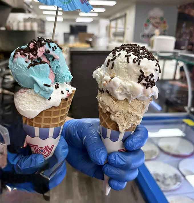 Ice cream cones stacked tall enough to require engineering skills, proving dessert here means serious business.
