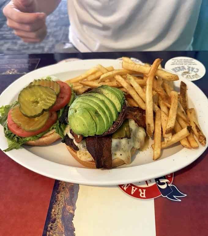 That burger comes loaded with avocado and all the fixings, proving sometimes the best things require two hands and zero shame.