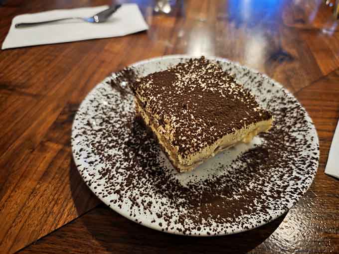 Tiramisu dusted with cocoa is the perfect ending to a meal that started strong and never let up.